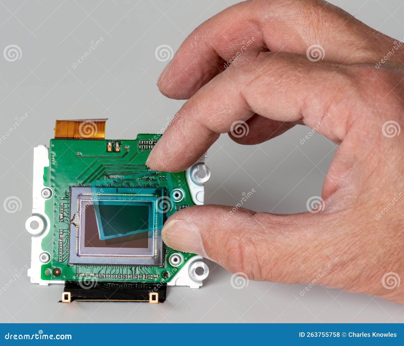 Service Worked Adds a Filter Over a Camera Imager Sensor Stock Photo ...