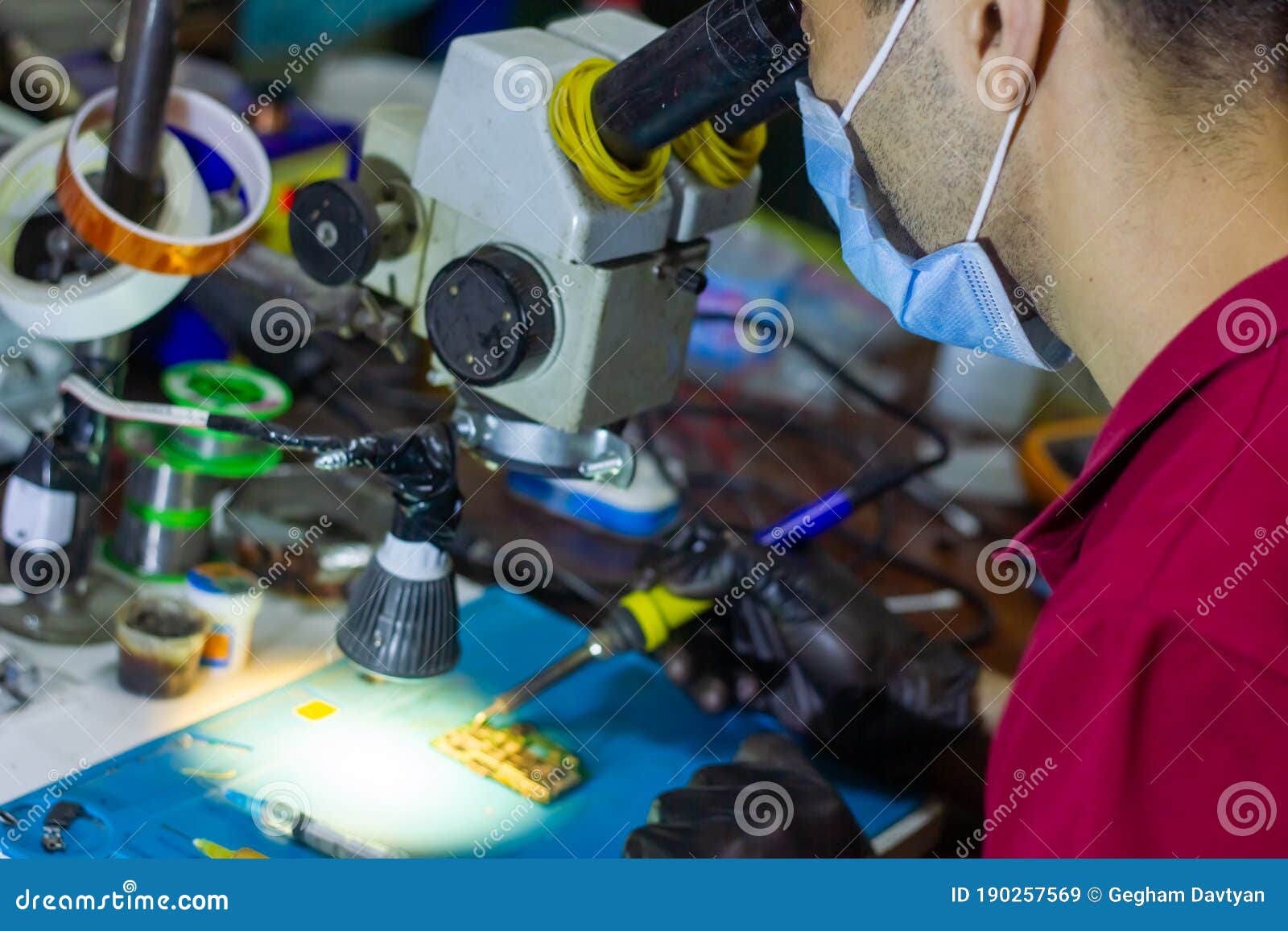 Service Worker Repairing Mobile Phone with Microscope Stock Image ...