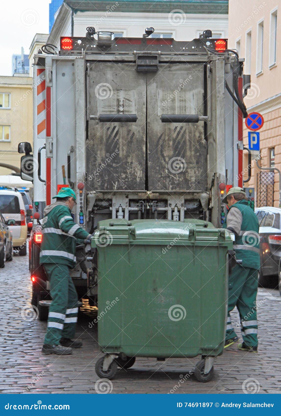 Service Workers Is Loading Trash From Dustbin To Garbage Truck ... Service Workers Is Loading Trash From Dustbin To Garbage Truck ...