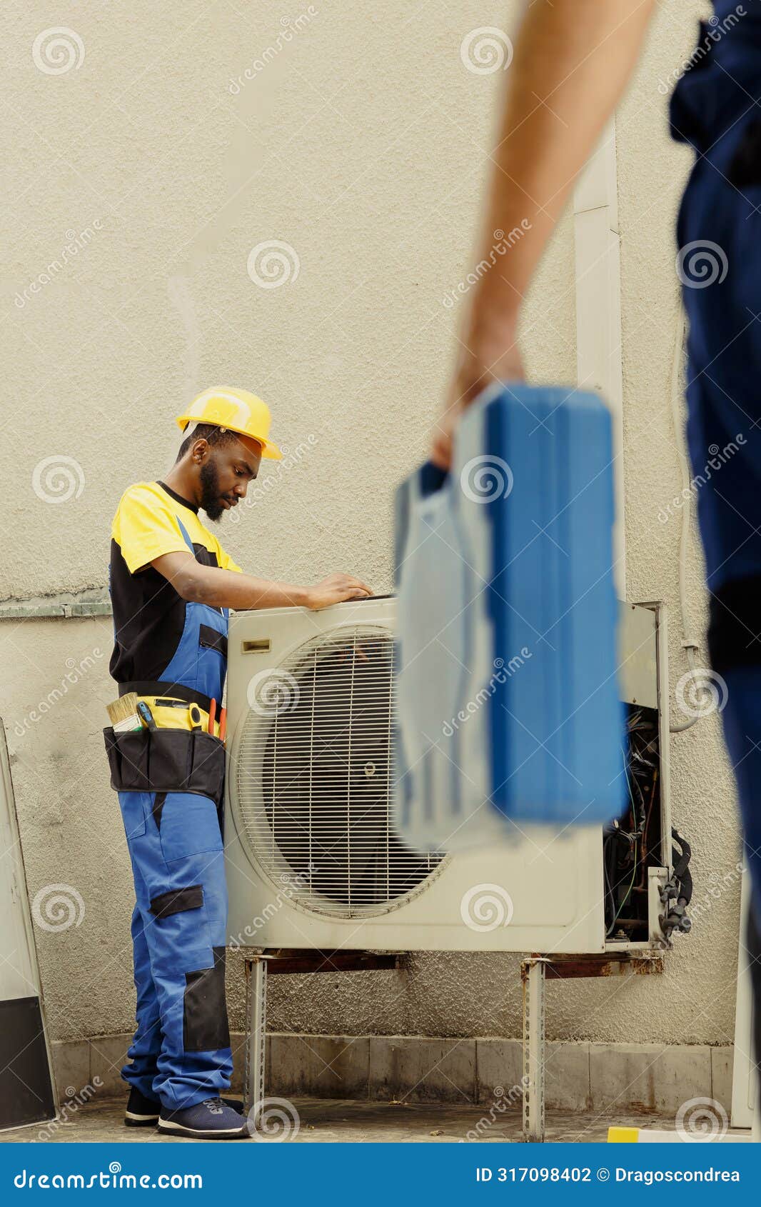 Serviceman Arriving To Help Apprentice Stock Photo - Image of ...