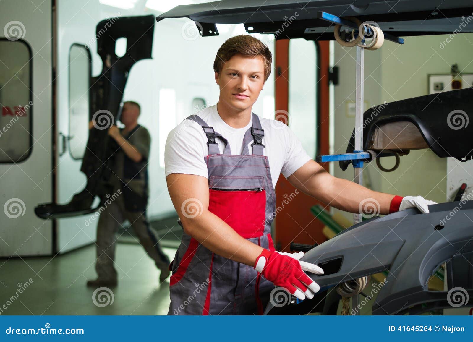 Serviceman in car workshop stock photo. Image of professional - 41645264