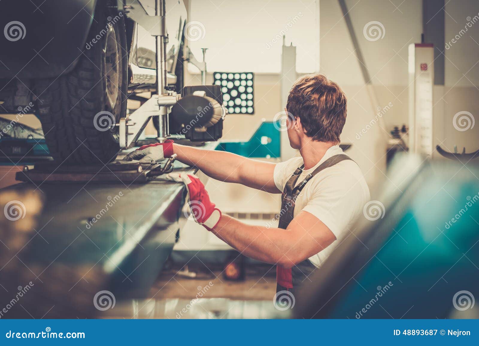 Serviceman in a Car Workshop Stock Image - Image of industry, mechanic ...