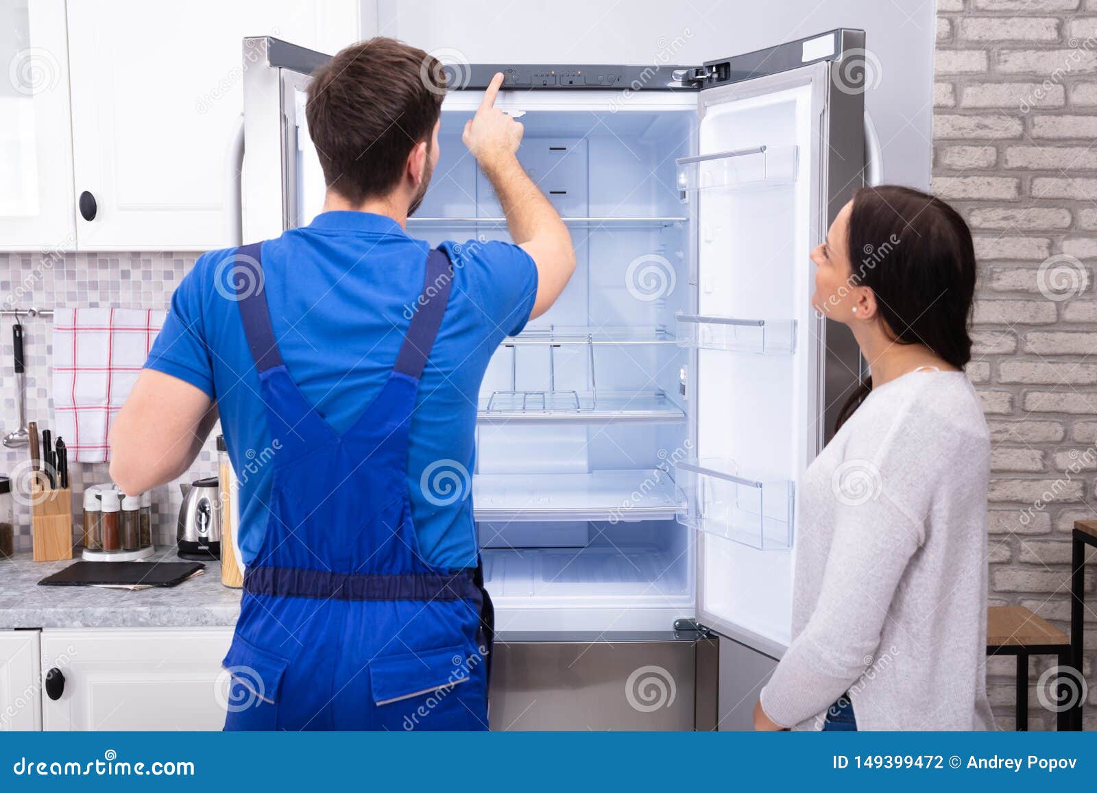Serviceman Checking Temperature of Refrigerator Stock Photo - Image of ...