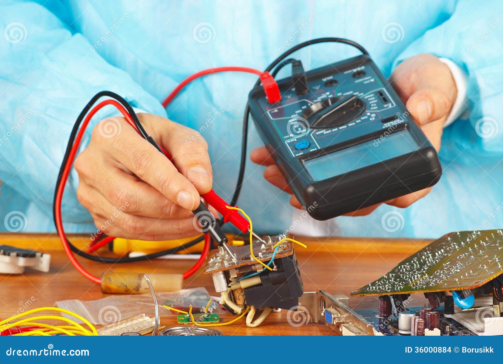Serviceman Checks Electronic Board with a Multimeter Stock Photo ...