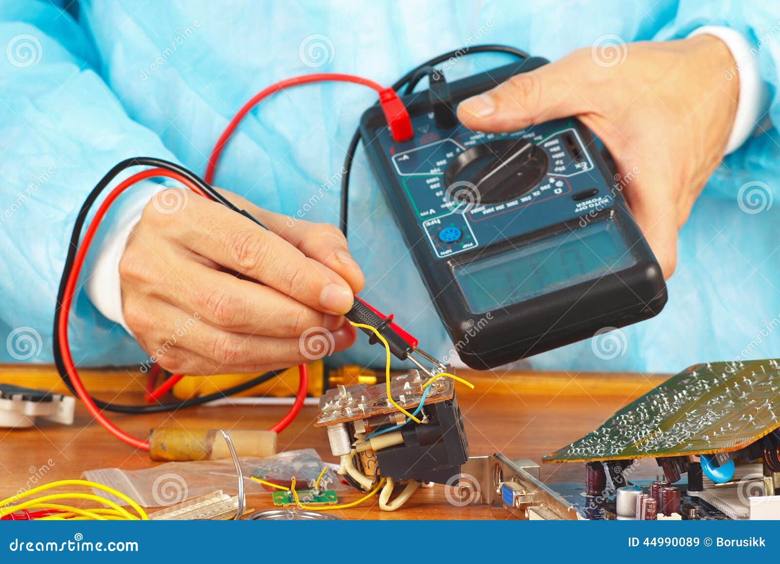 Serviceman Checks Electronic Hardware with a Multimeter in Service ...