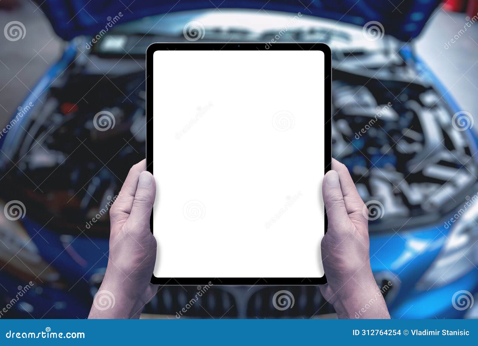 Serviceman Holds a Tablet in Front of a Car with an Open Engine ...