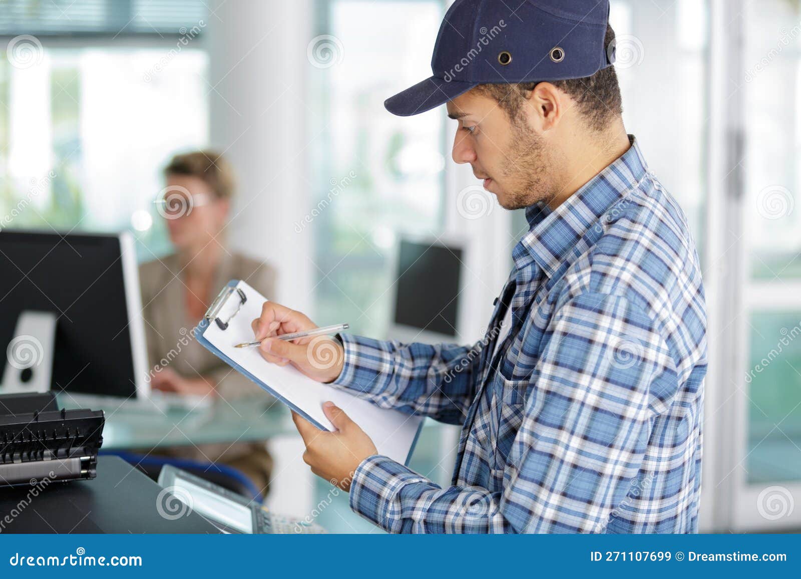 Serviceman in Office Checking Paperwork on Clipboard Stock Image ...