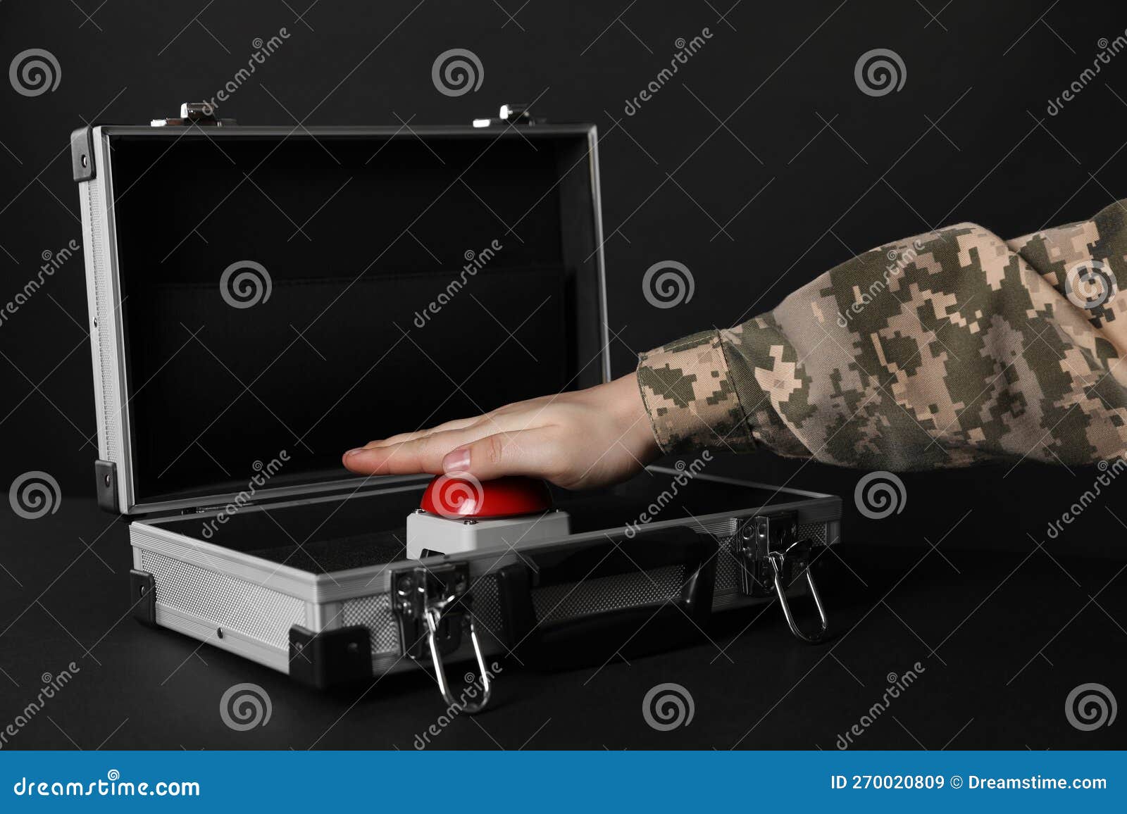 Serviceman Pressing Red Button of Nuclear Weapon at Black Table ...