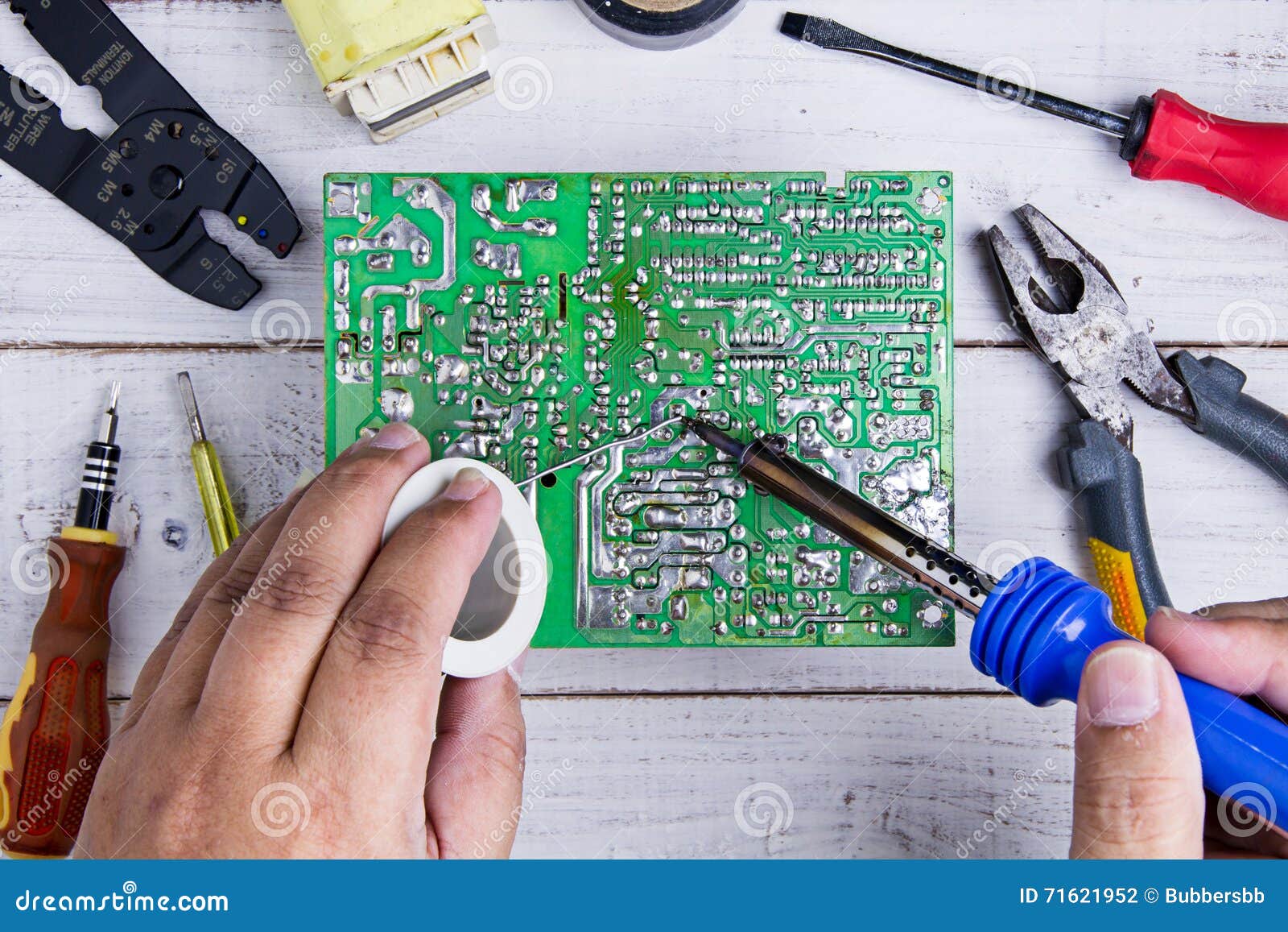 Serviceman Soldering Circuit Board with Soldering Iron Stock Photo ...