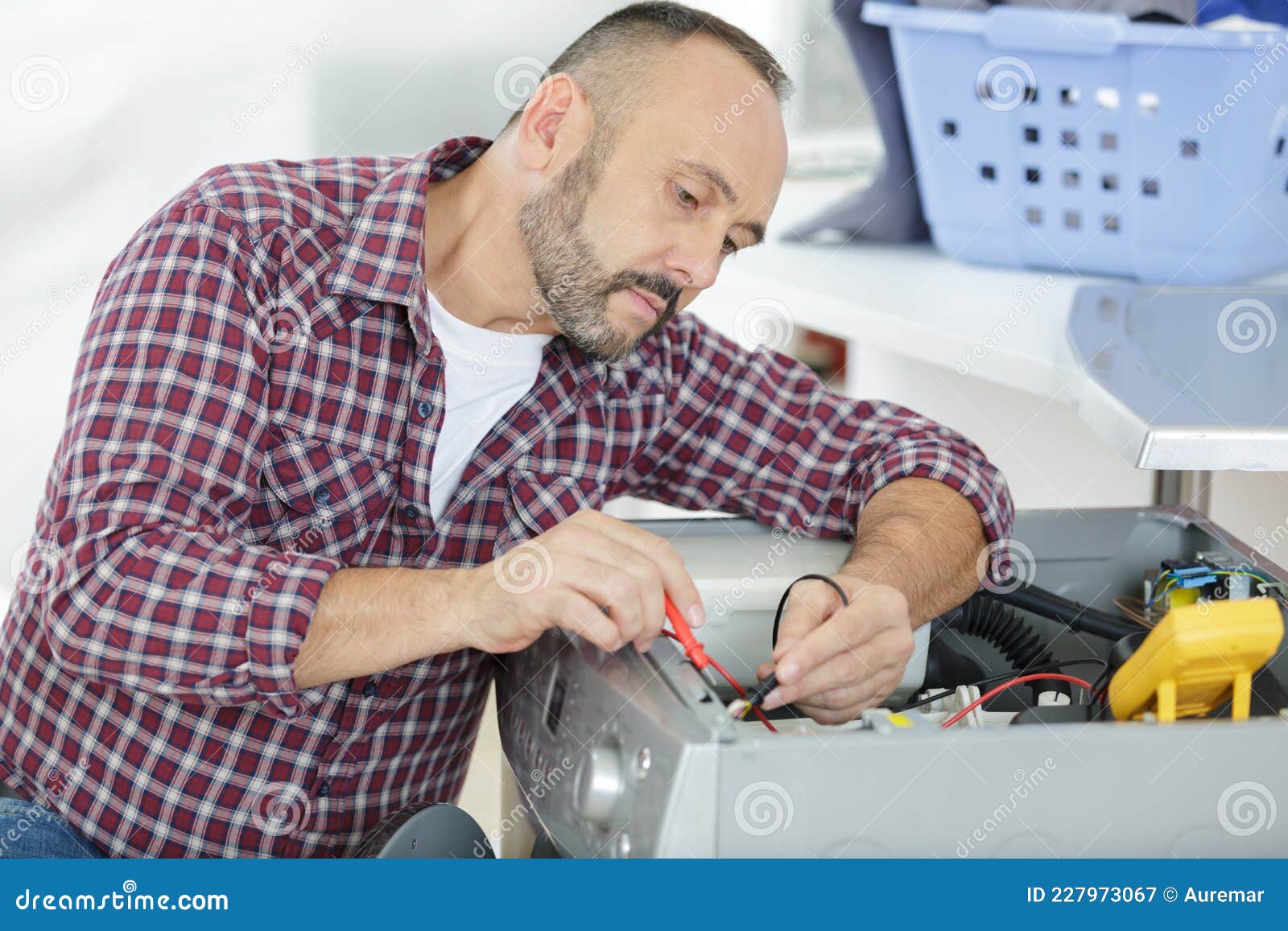 Serviceman Testing Washing Machine with Multimeter Stock Image - Image ...