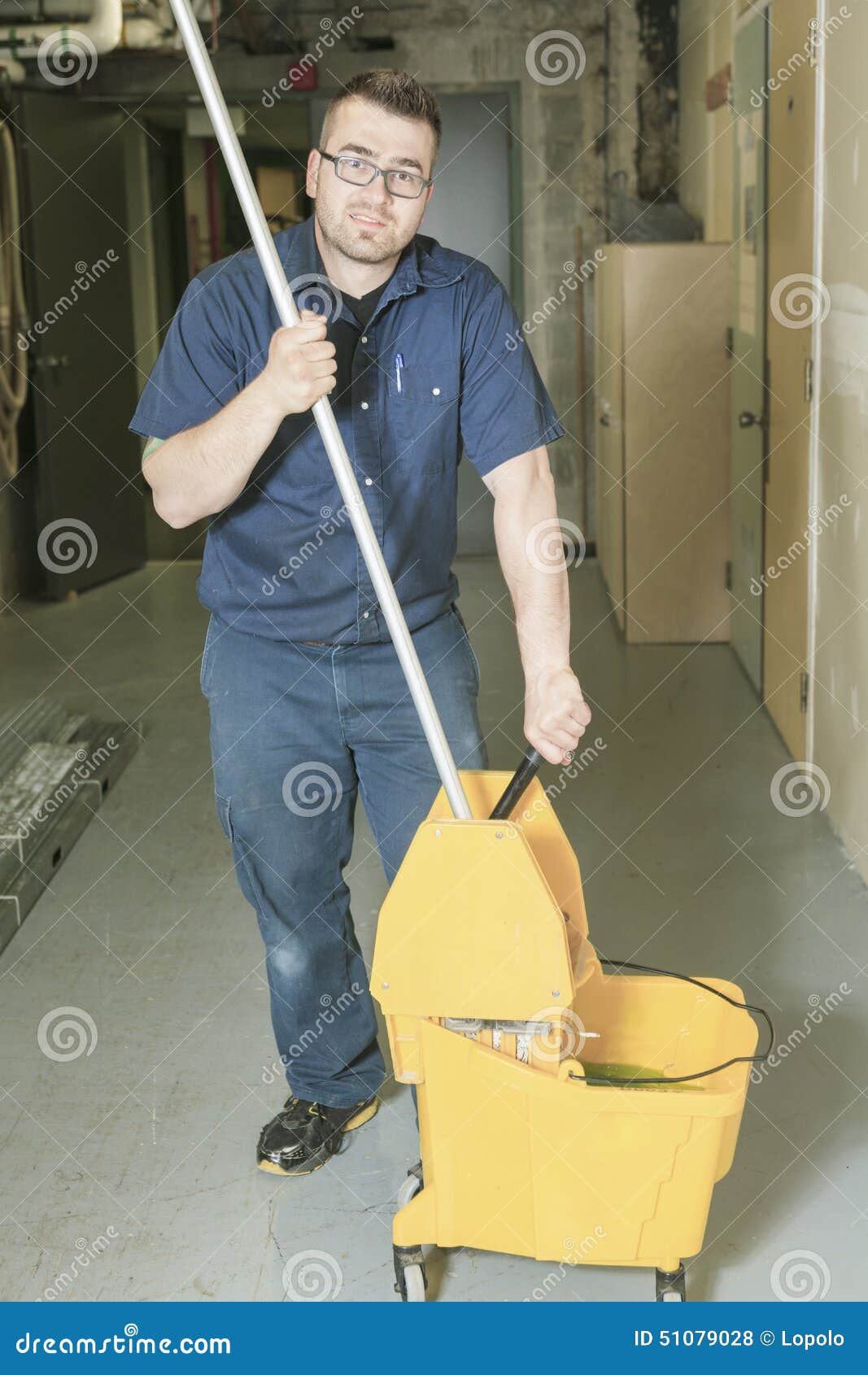 Serviceman Who Cleaning the Floor with His Mop Stock Photo - Image of ...
