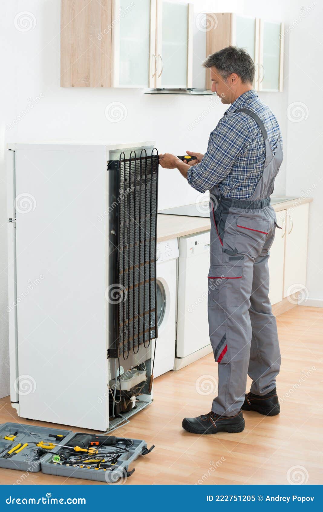 Serviceman Working on Fridge at Home Stock Image - Image of home ...