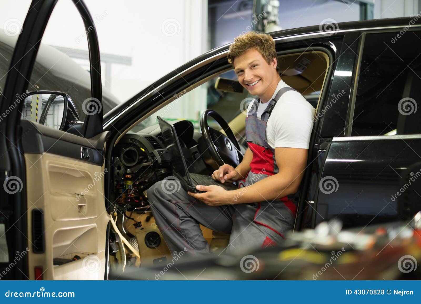 Serviceman in a workshop stock photo. Image of inspection - 43070828