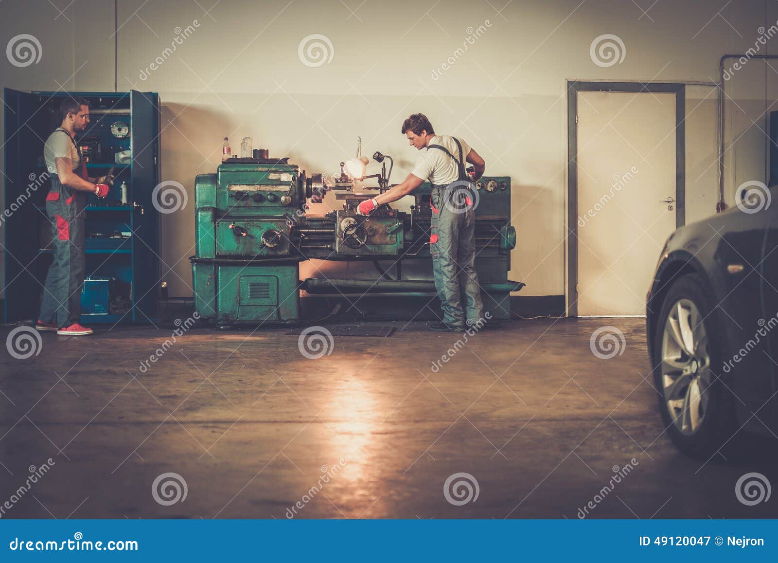 Servicemen in car workshop stock image. Image of fixing - 49120047
