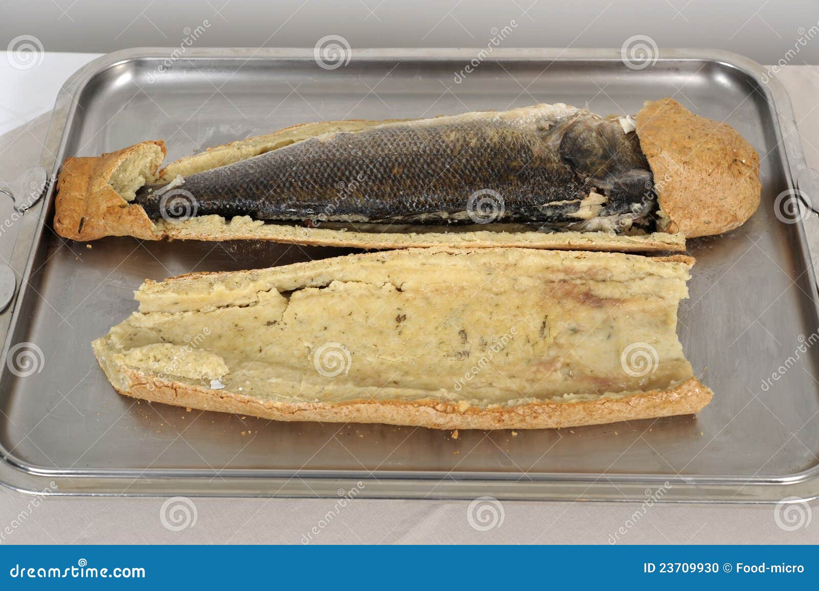 Serving a Bass Baked in Salt Crust Stock Photo - Image of full, bass ...