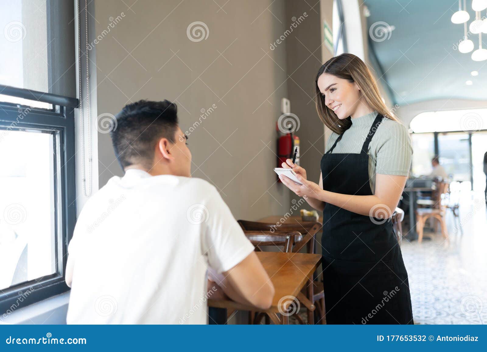 Serving Customers with a Smile Stock Photo - Image of caucasian ...
