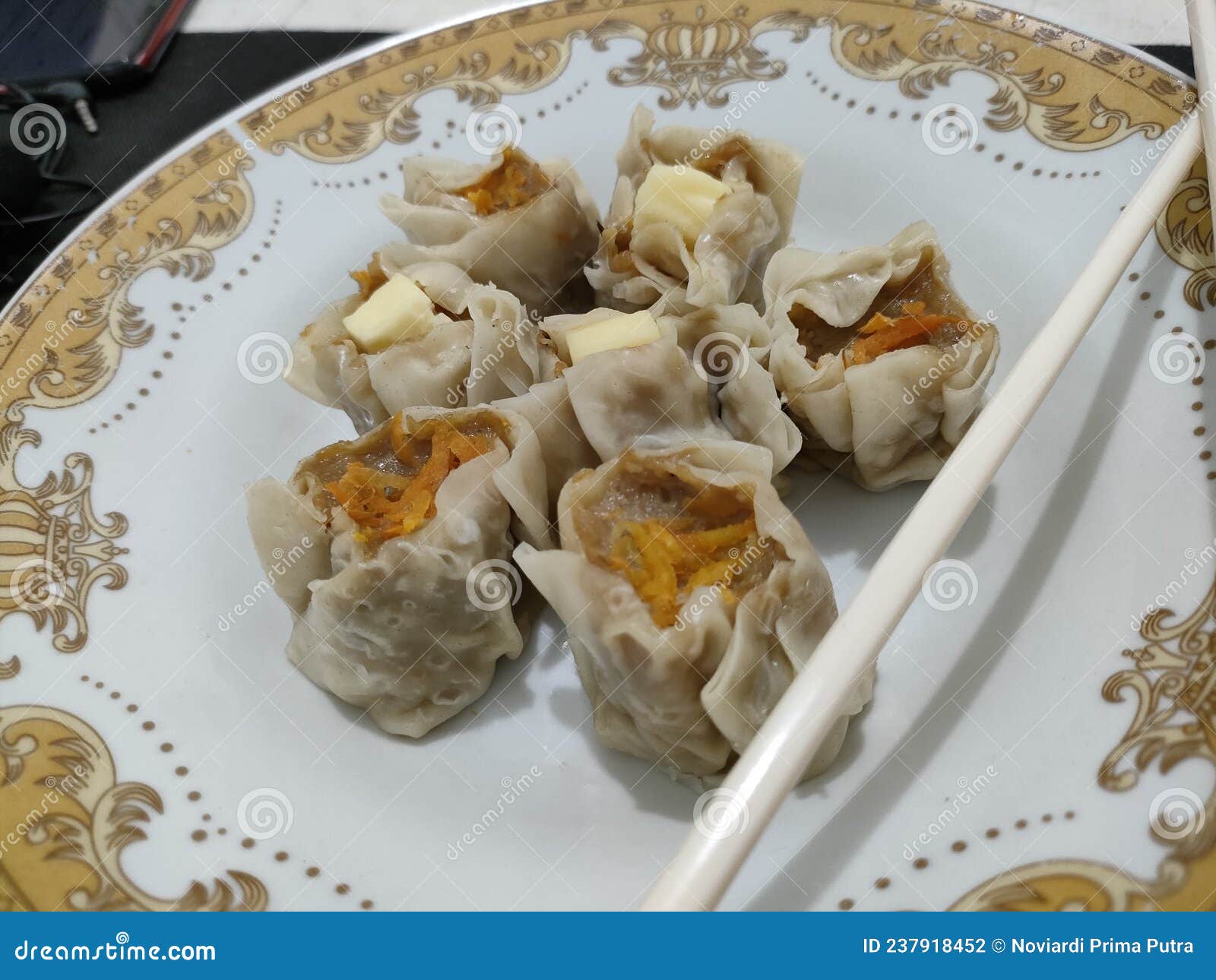A Serving of Dim Sum Placed on a Patterned Glass Plate Stock Photo ...