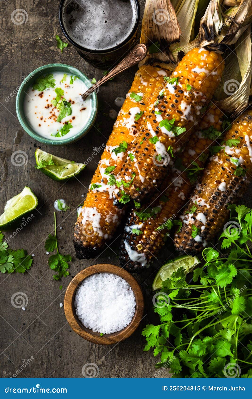 Serving Grilled Corn Cob with Fresh Herbs,lime,beer at Picnic, Top Down ...
