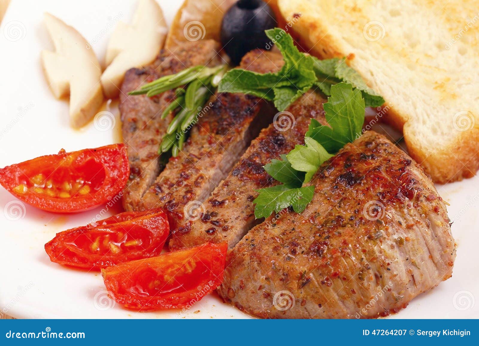 Serving of Meat with Vegetables on a Plate of White Background Stock ...