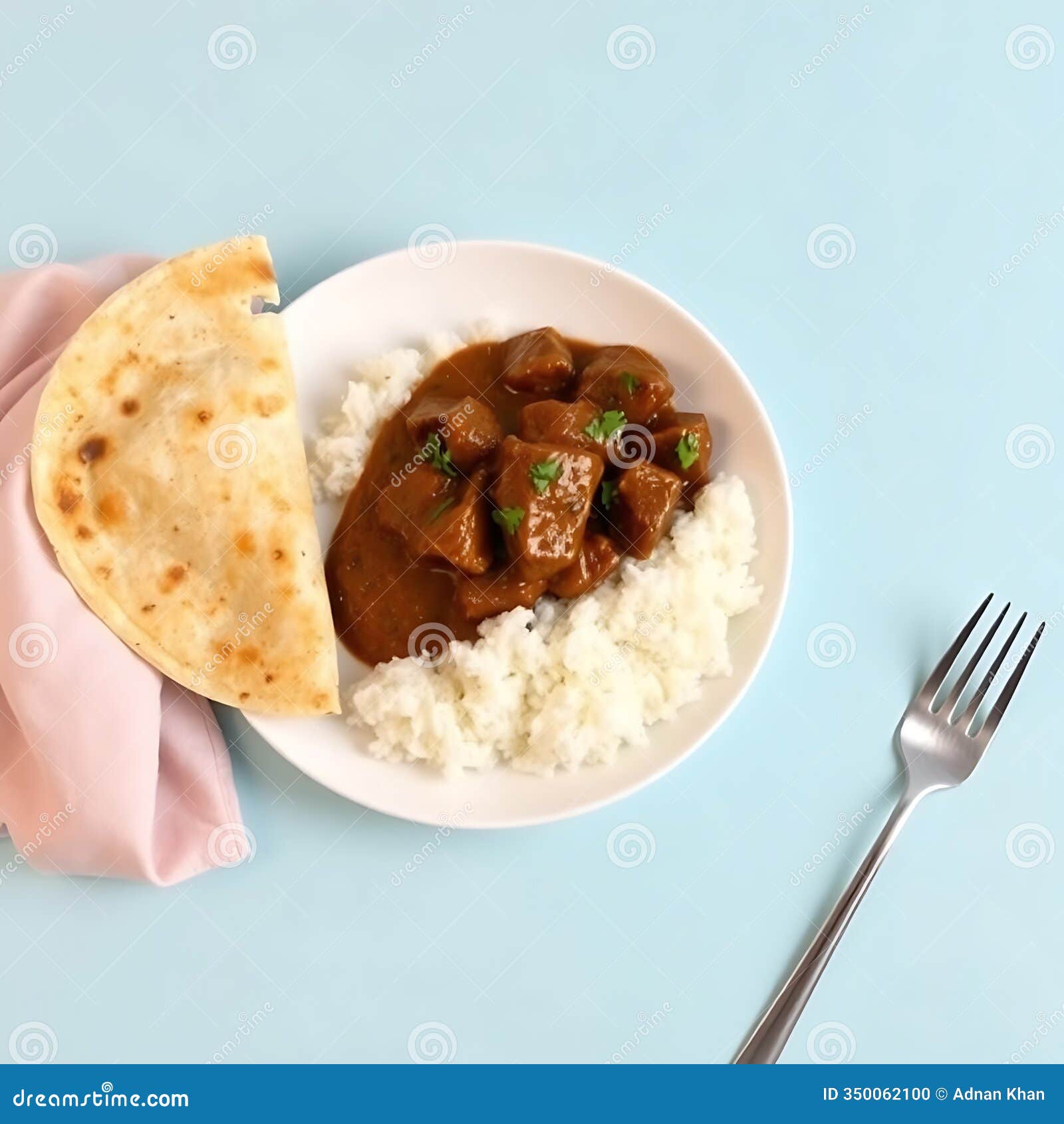 A Serving of Mutton Curry with Rice and Roti on a Pastel Blue ...