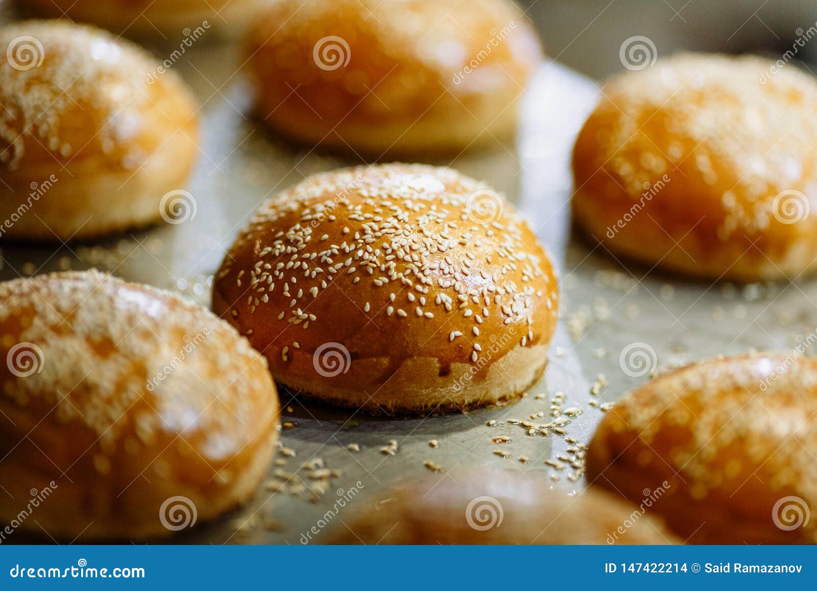 Sesame Buns Close Up on Metallic Background Stock Photo - Image of ...