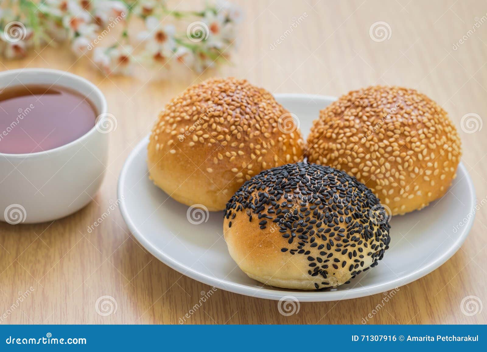 Sesame Buns On Plate And Tea Cup Stock Photo | CartoonDealer.com #69896862
