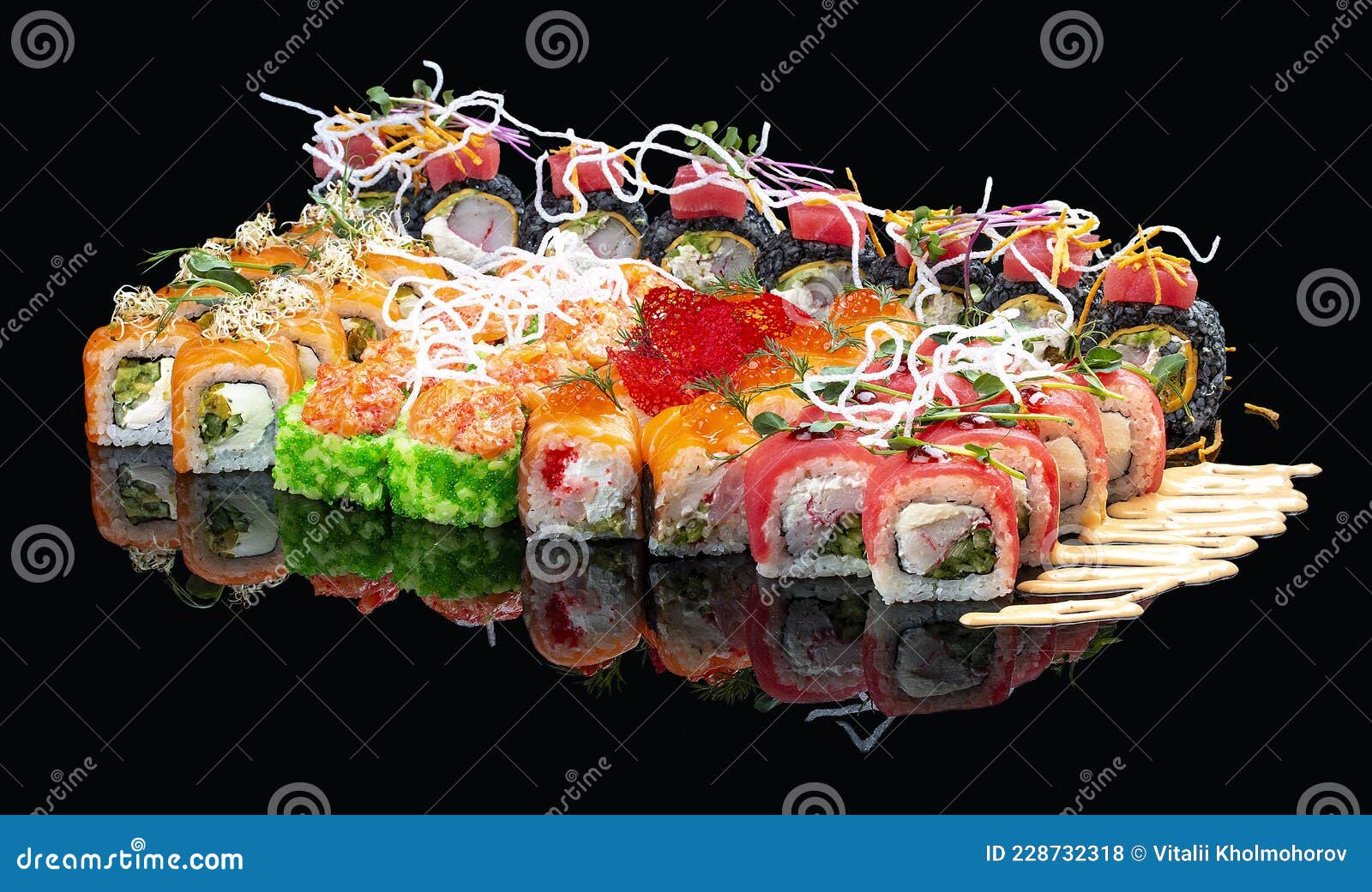 A Set of Assorted Large Sushi Rolls on a Glossy Black Background Stock ...