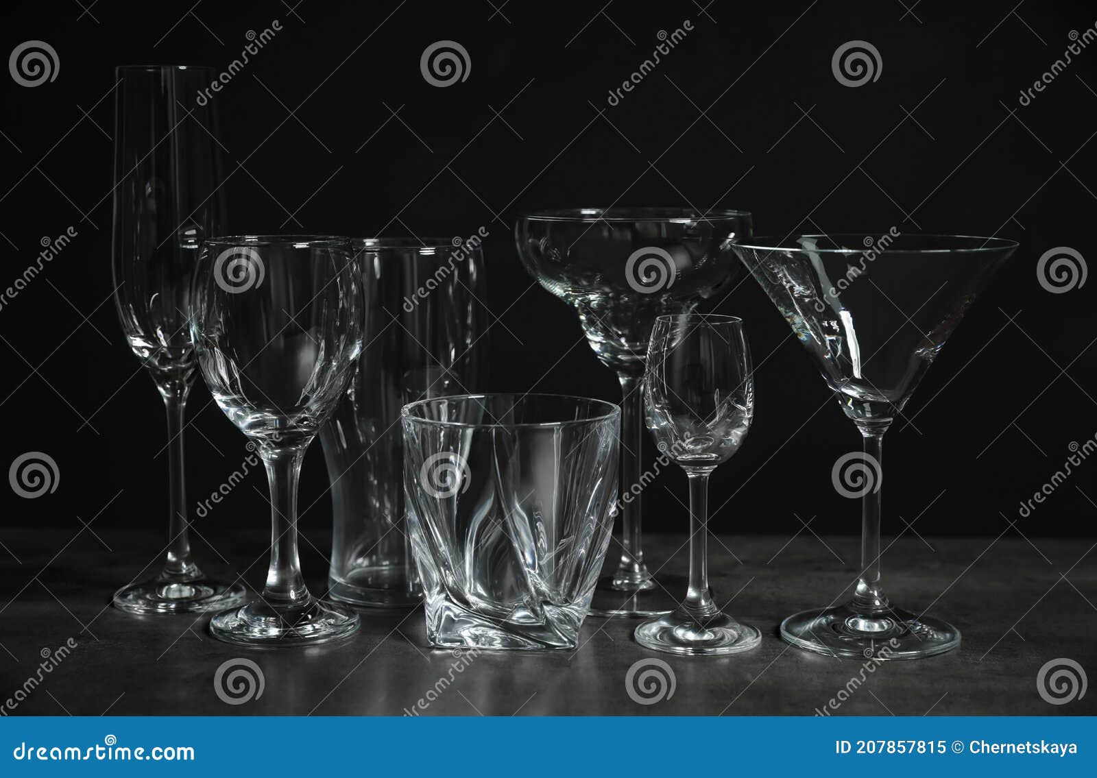 Set of Bar Glassware on Table Against Dark Background Stock Image ...