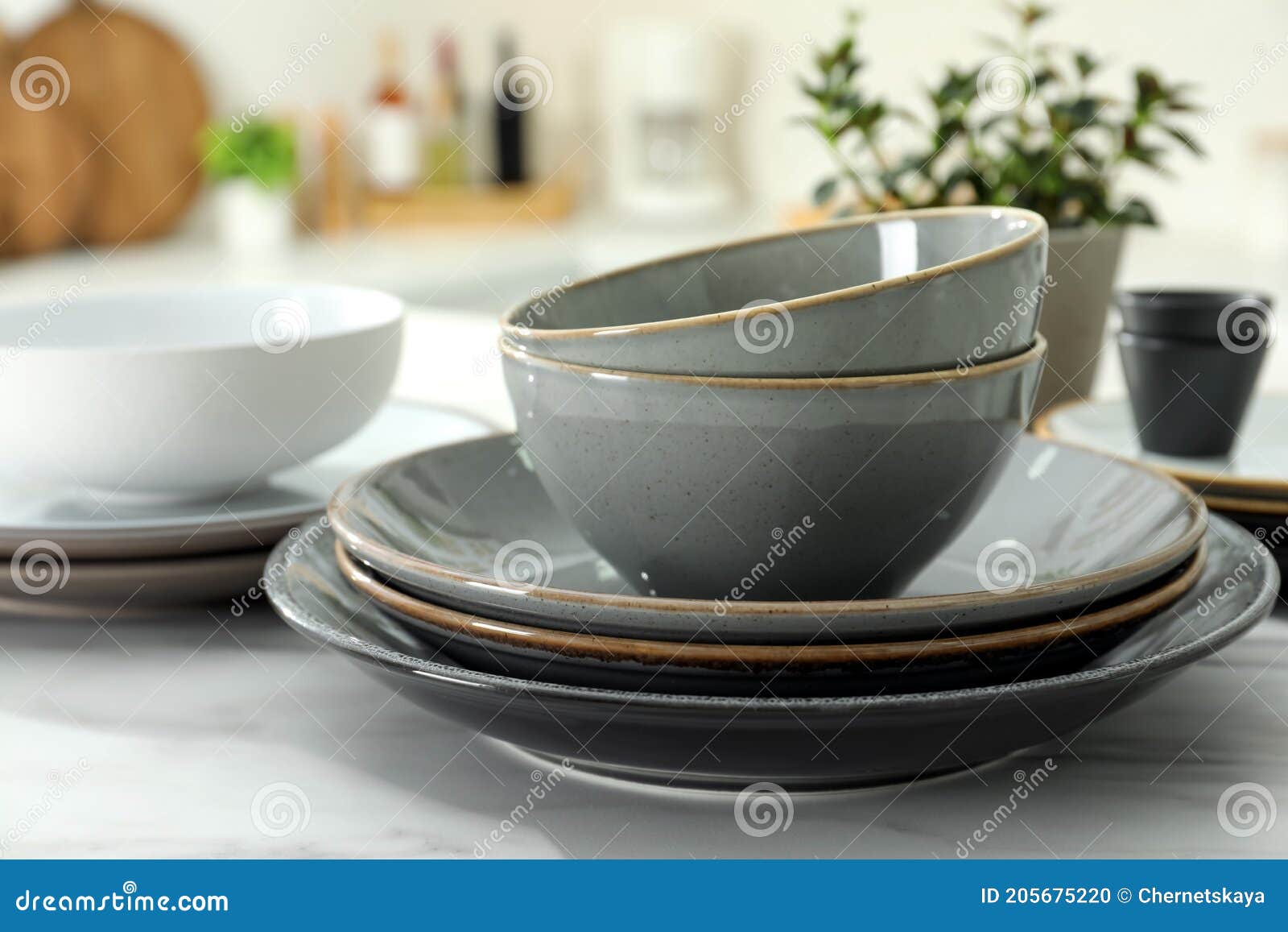 Set of Beautiful Ceramic Tableware on White Table in Kitchen Stock ...