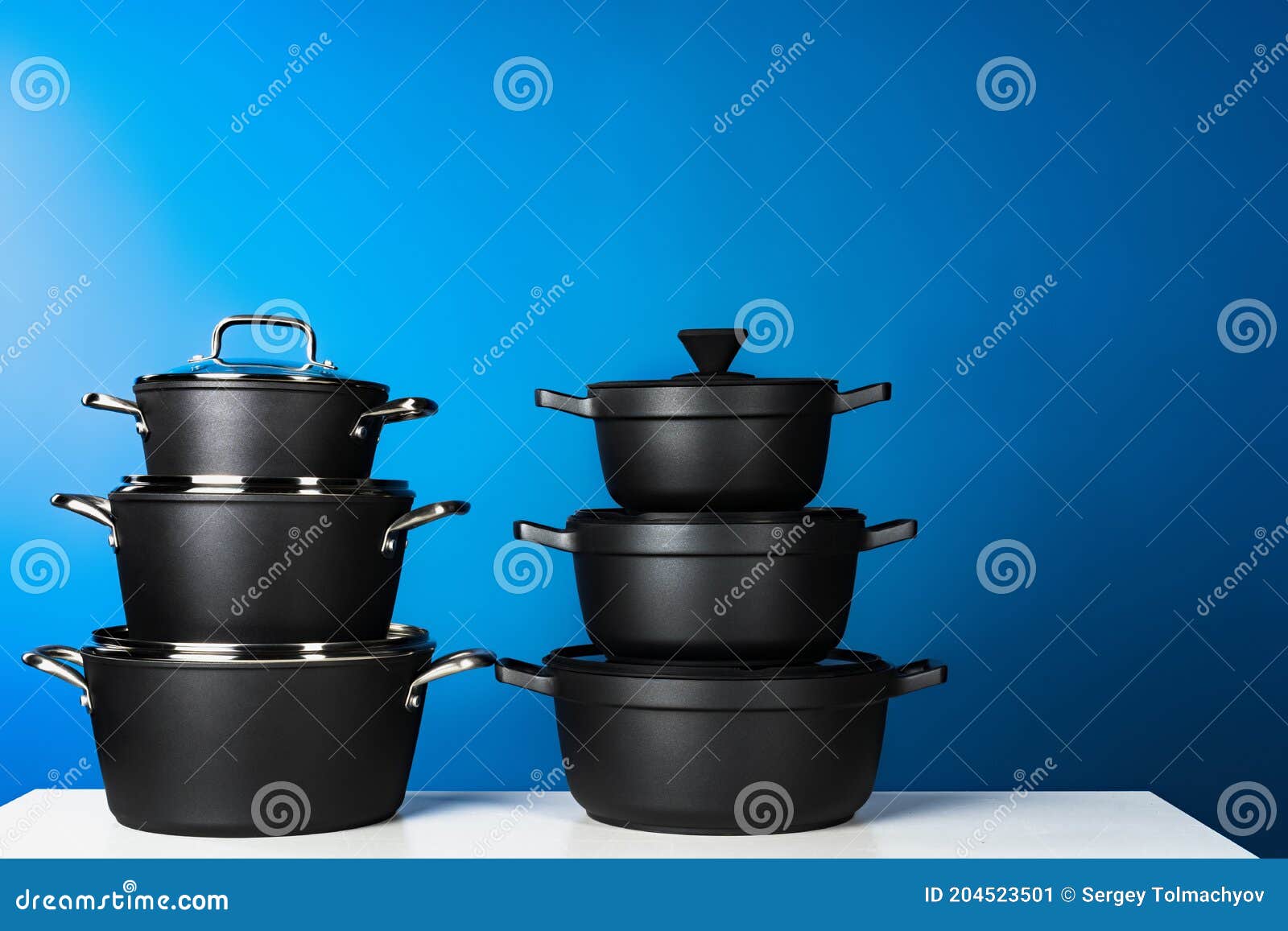 Set of Black Cookware Against Blue Background Stock Image - Image of ...