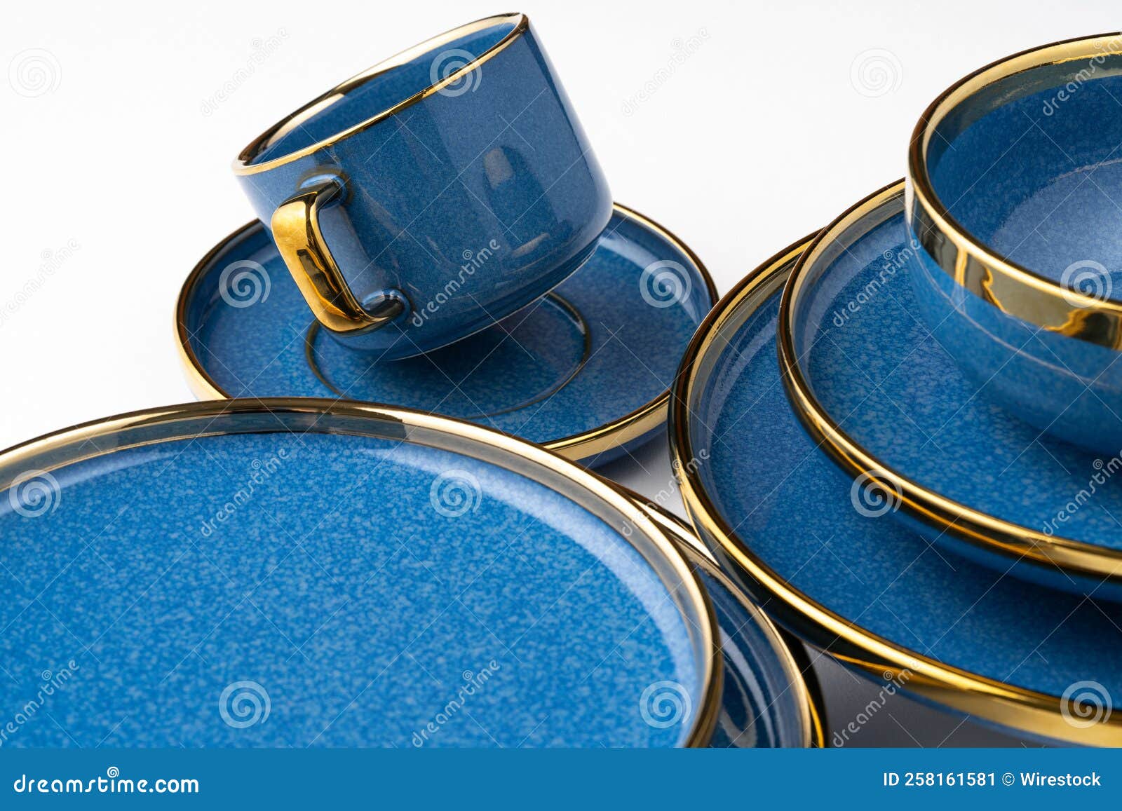 Set of Blue Ceramic Plates and Cup on a White Background Stock Image ...