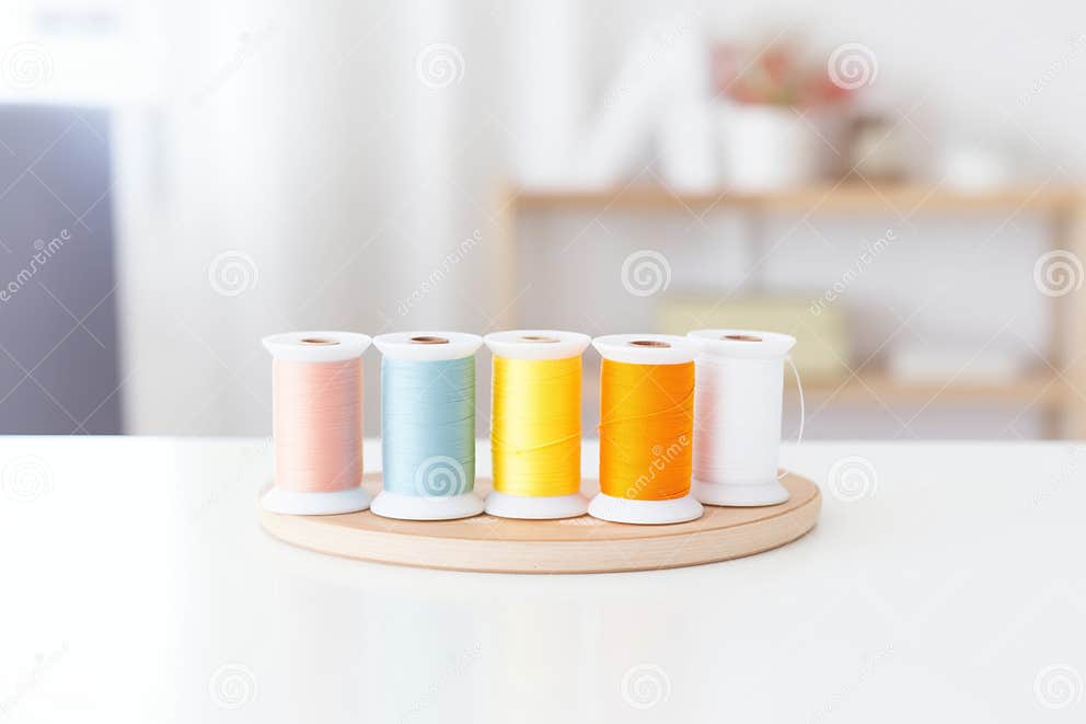 Set of Bright Spools of Threads on a Clean White Table Stock Image ...