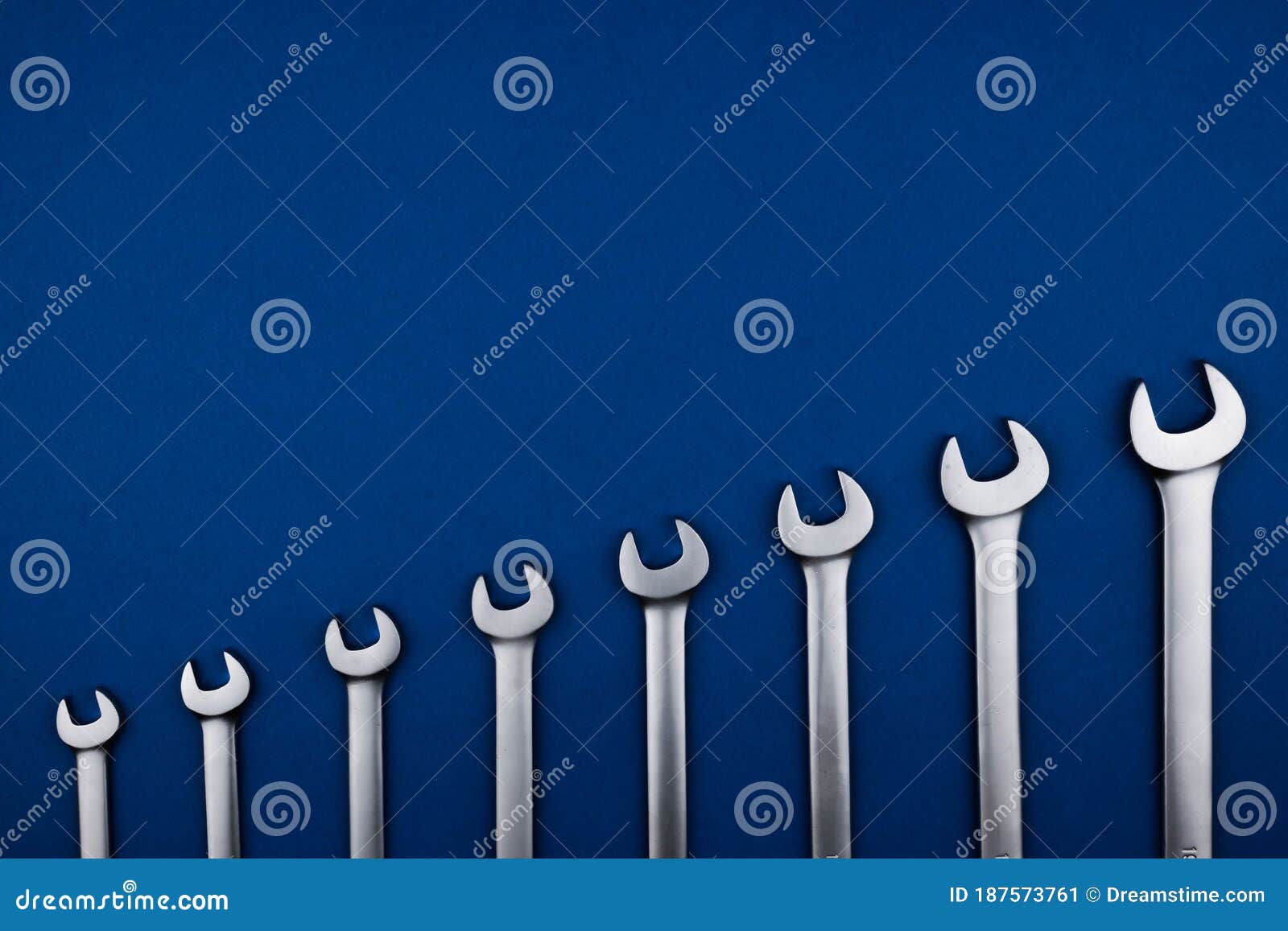 Set Chrome Spanner Keys Lying Side by Side on Blue Background. Flat Lay ...