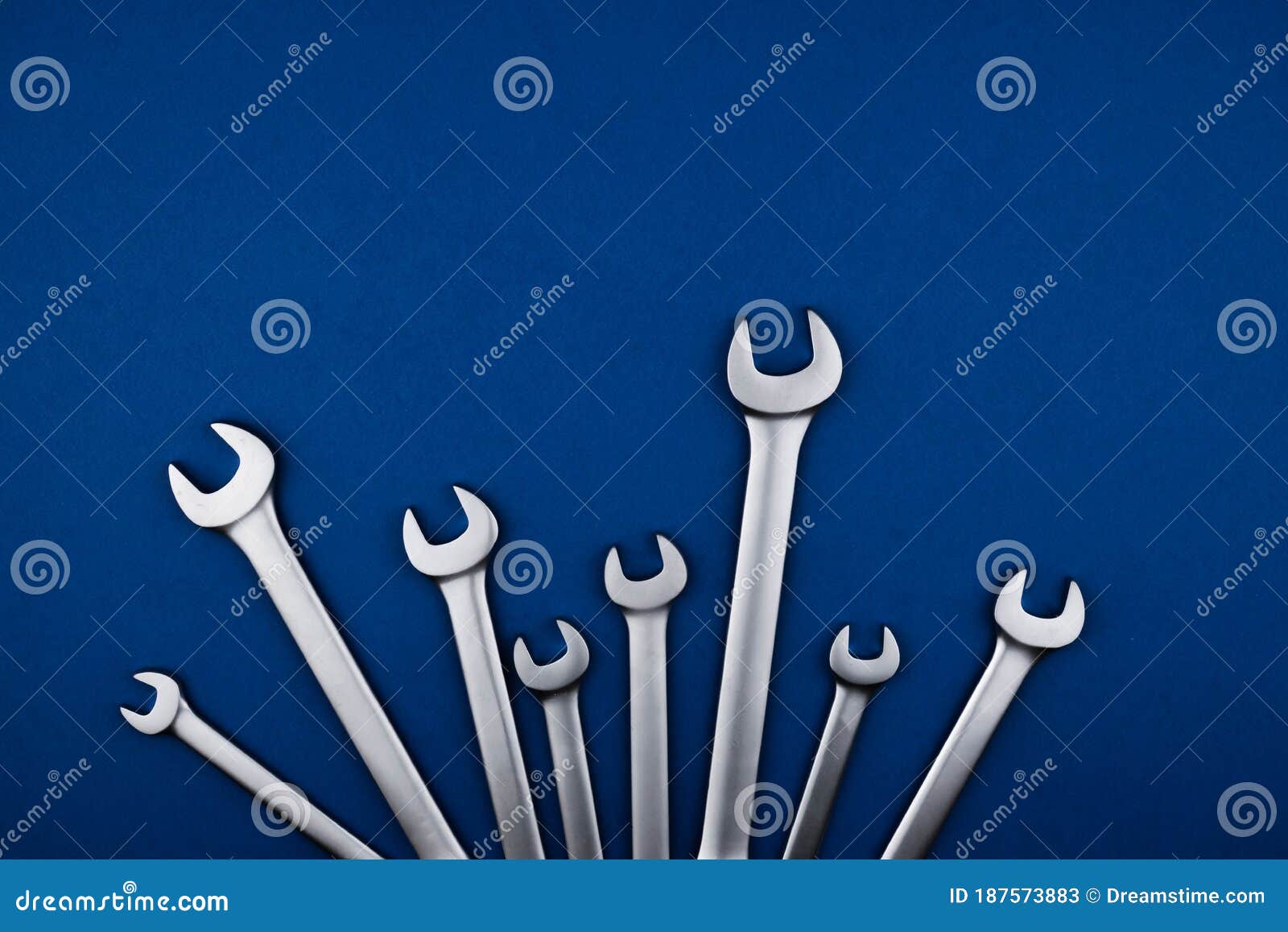 Set Chrome Spanner Keys Lying Side by Side on Blue Background. Flat Lay ...