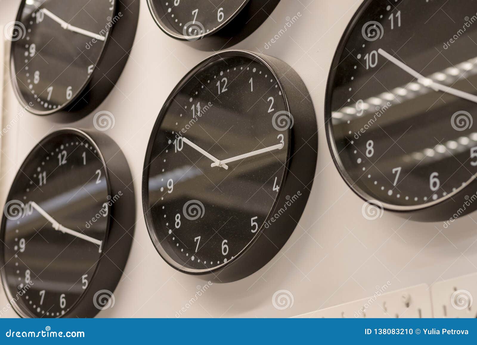 Many Different Wall Clock on the Wall .Set of Clockfaces . Concept of ...