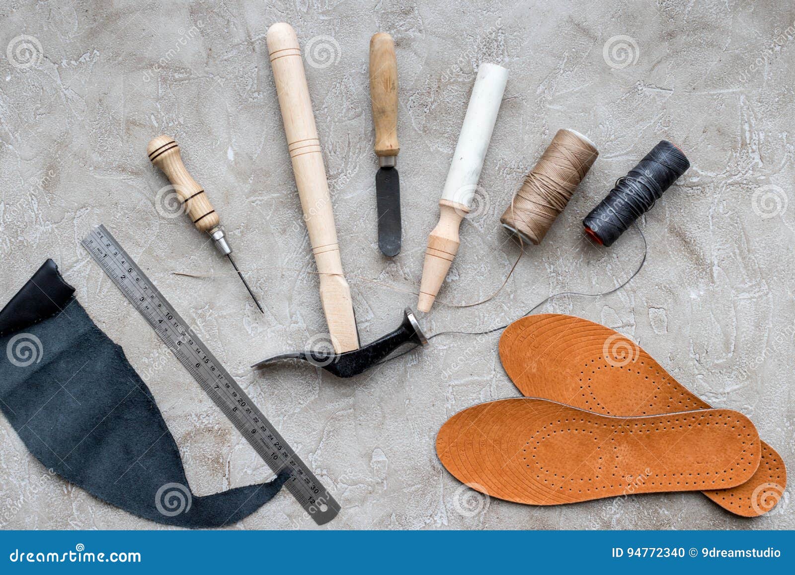 Set of Cobbler Tools on Grey Stone Desk Background Top View Stock Photo ...