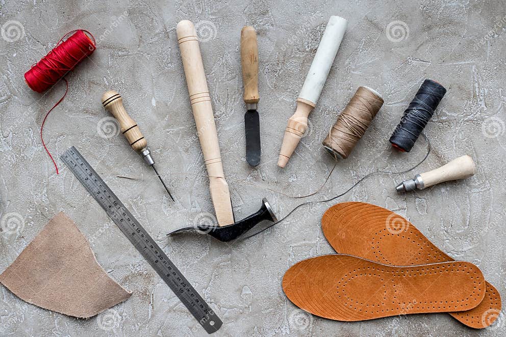 Set of Cobbler Tools on Grey Stone Desk Background Top View Stock Image ...