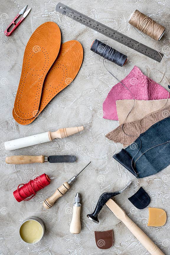 Set of Cobbler Tools on Grey Stone Desk Background Top View Stock Image ...