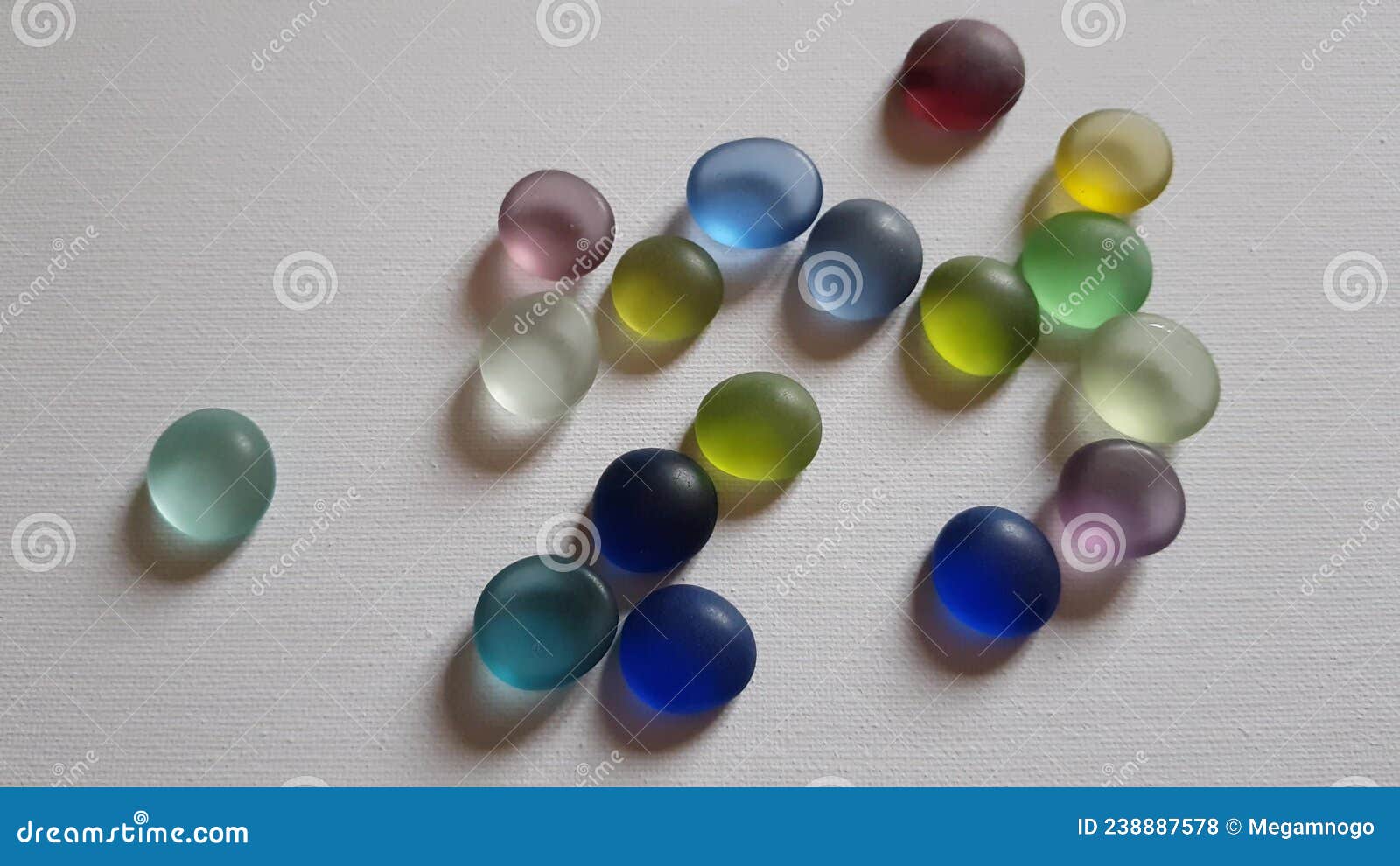 Set of Colored Matte Stones on a White Table. Top View Stock Photo ...