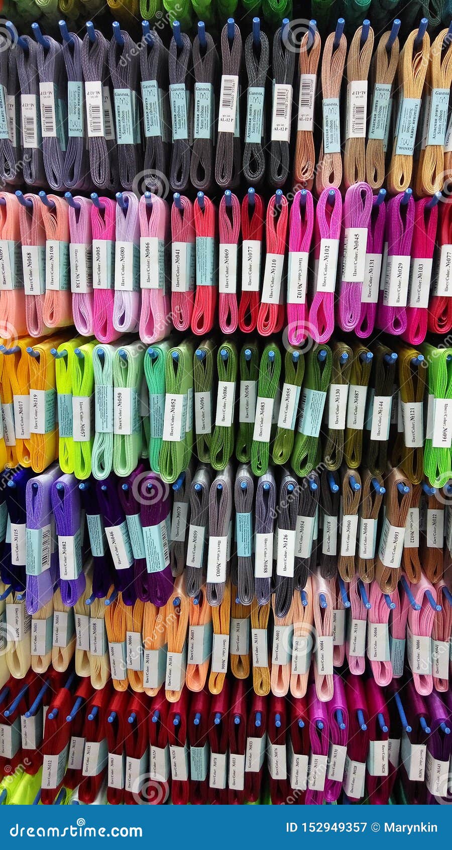 Set of Colored Threads for Sewing on Coils. Pile of Big Colorful Spools ...