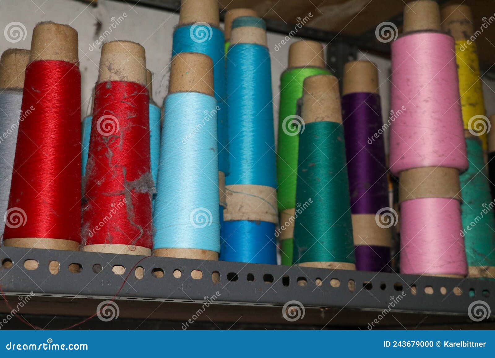 Set of Colored Threads for Sewing on Coils. Pile of Big Colorful Spools ...