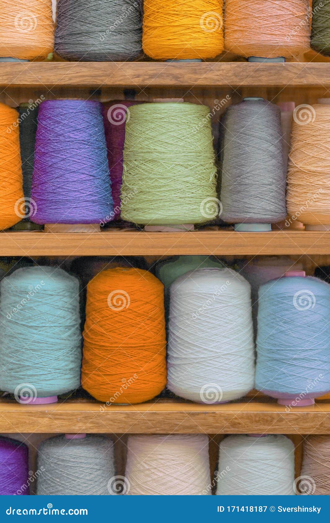 Multi-colored Large Spools of Thread in a Row. Spools of Colored Thread ...