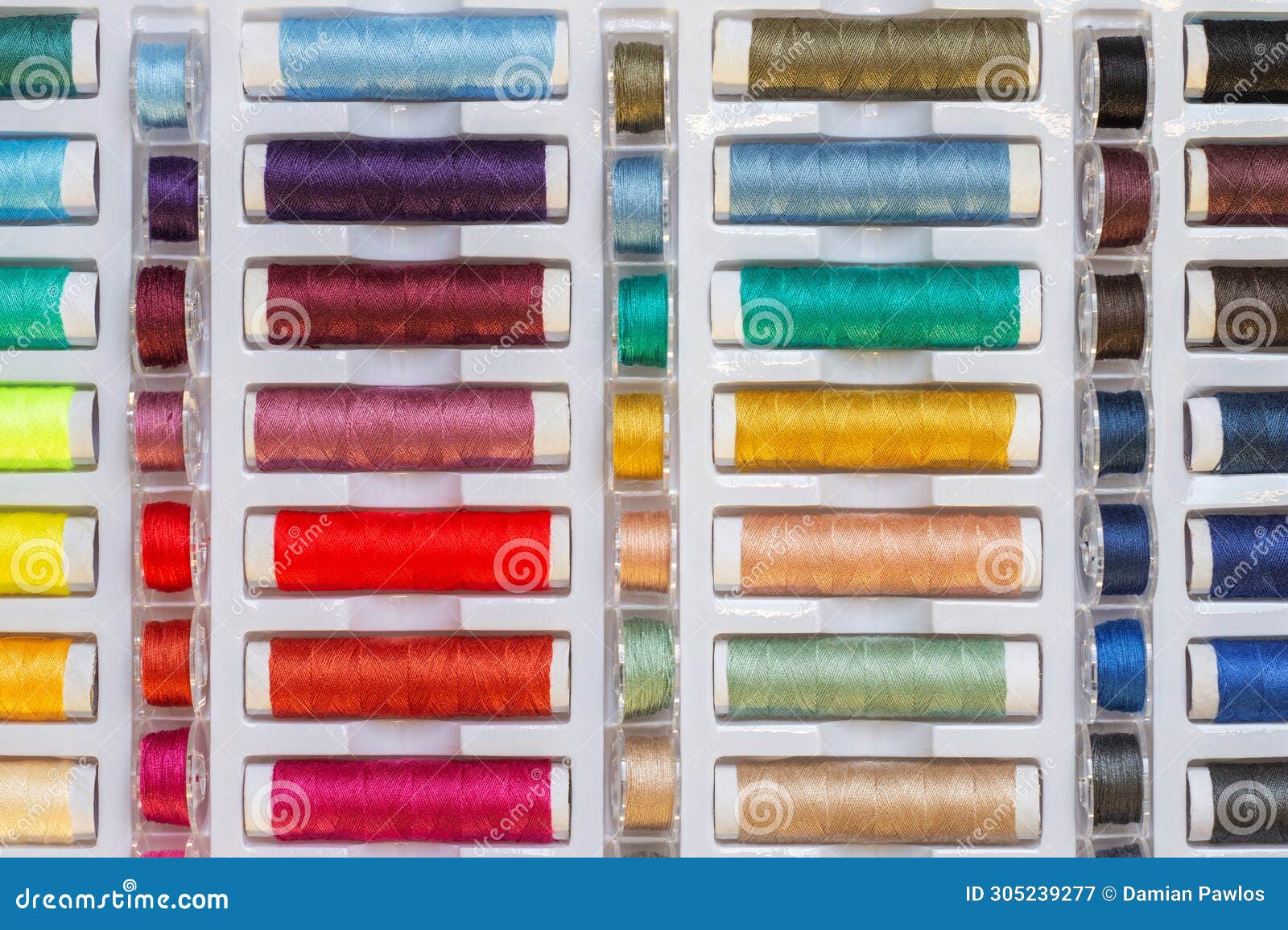 A Set of Colorful Threads and Plastic Bobbins for Sewing Machines ...