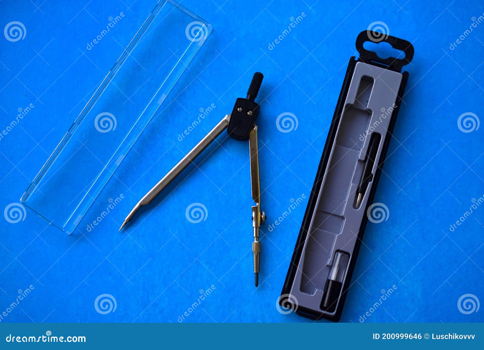 Set of Compasses in a Box on a Blue Background Stock Photo - Image of ...