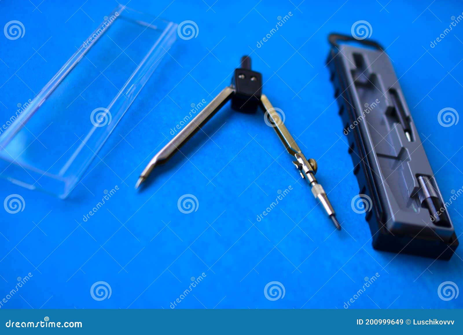 Set of Compasses in a Box on a Blue Background Stock Image - Image of ...