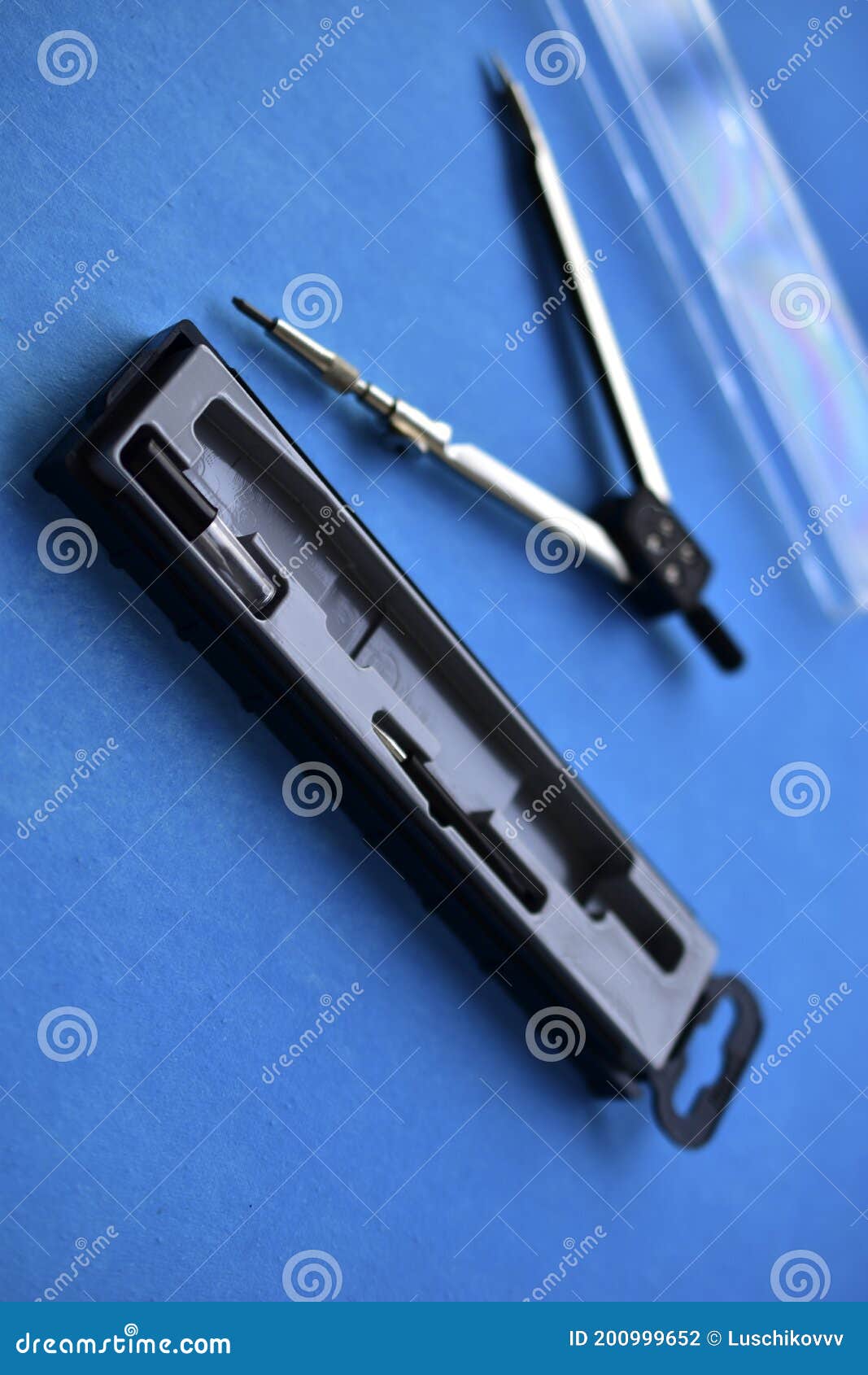 Set of Compasses in a Box on a Blue Background Stock Photo - Image of ...