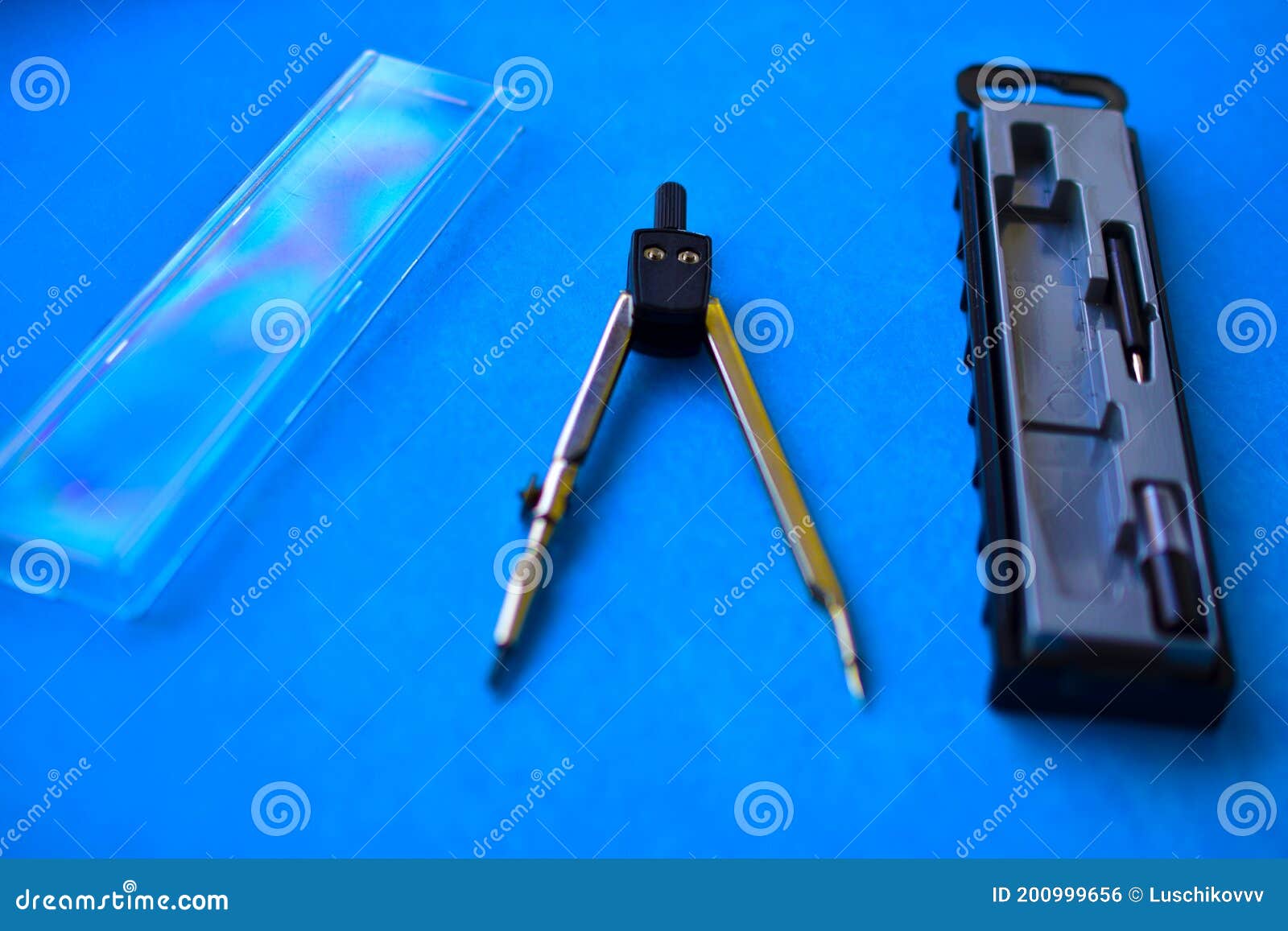 Set of Compasses in a Box on a Blue Background Stock Photo - Image of ...