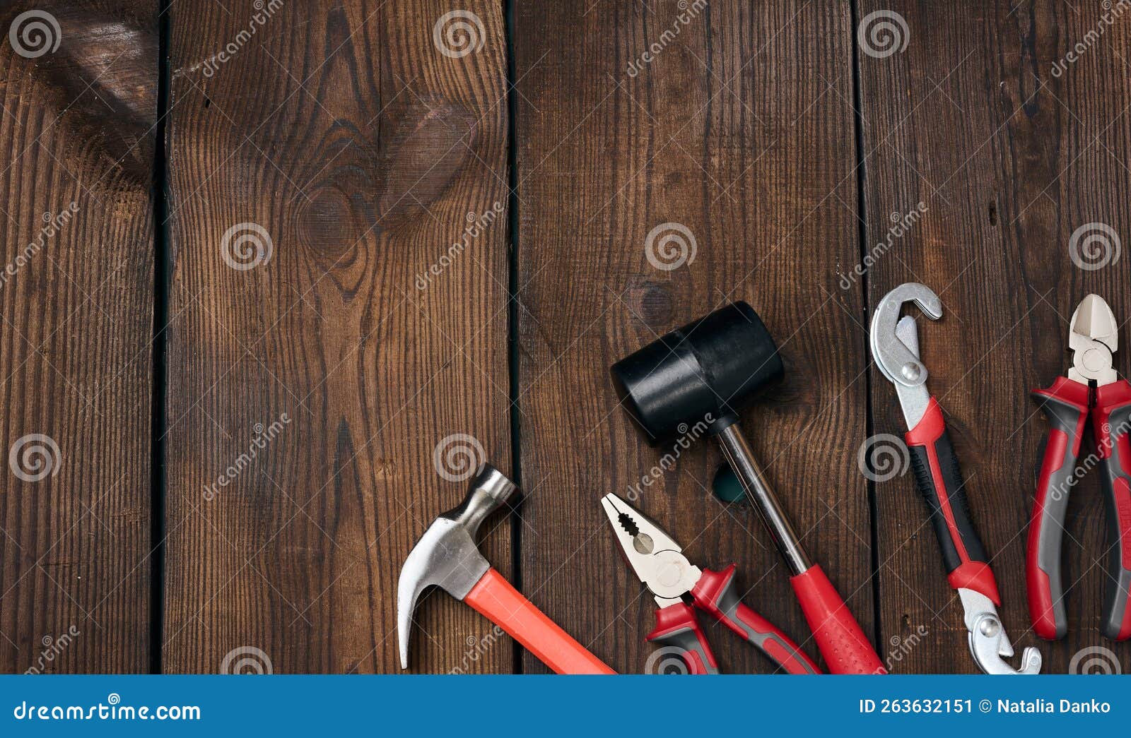 A Set of Construction Tools on a Brown Wooden Background, Top View ...