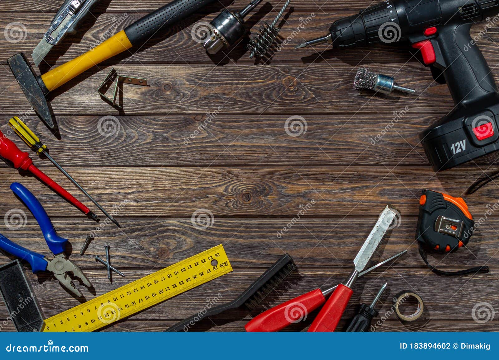 Set of Construction Tools Lying Around the Perimeter on a Wooden ...