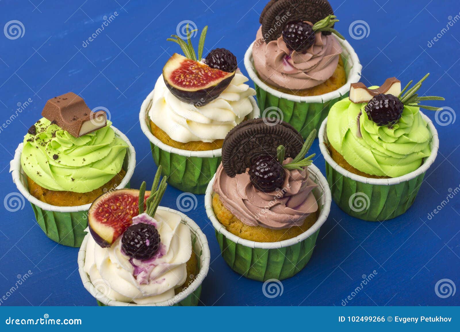 A Set of Cupcakes on a Blue Background. Stock Photo - Image of dessert ...